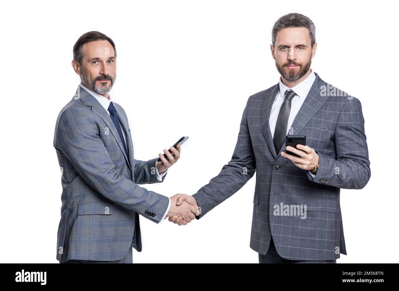 men texting message with handshake in studio. men texting message on ...