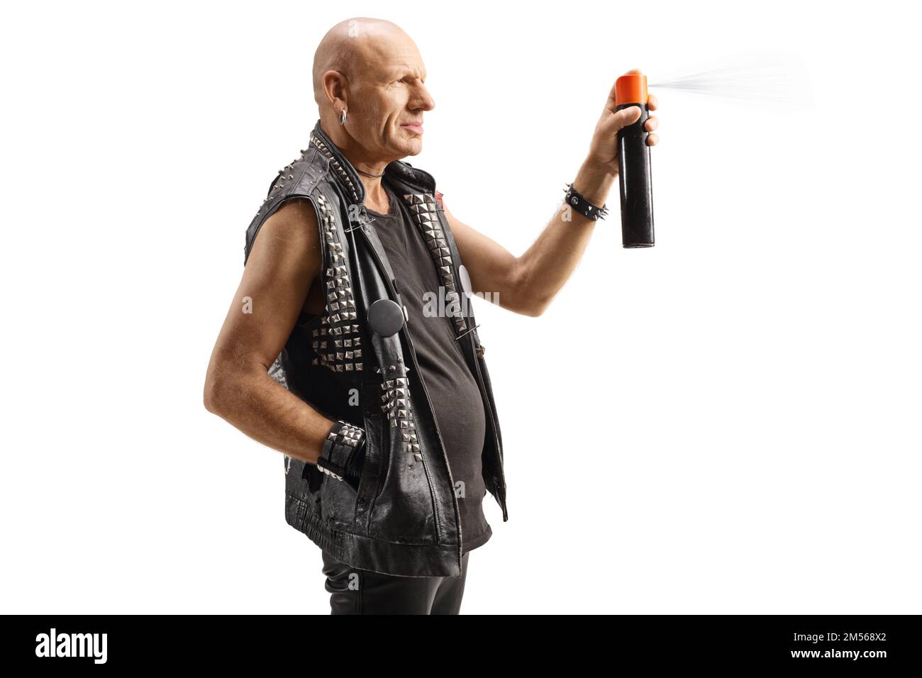Profile shot of a punk using a spray can isolated on white background ...