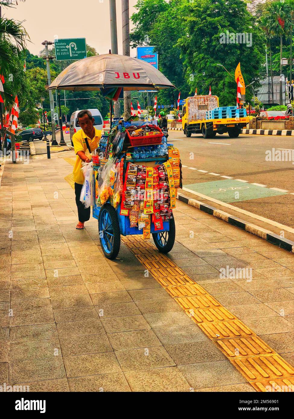 A roadside vendor selling activity from a father in the Bogor city area ...