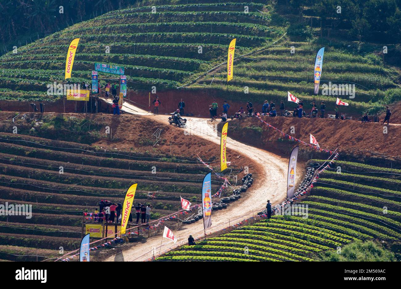 Hmong hill tribe men drive formula hmong (the wooden cart racing the ...