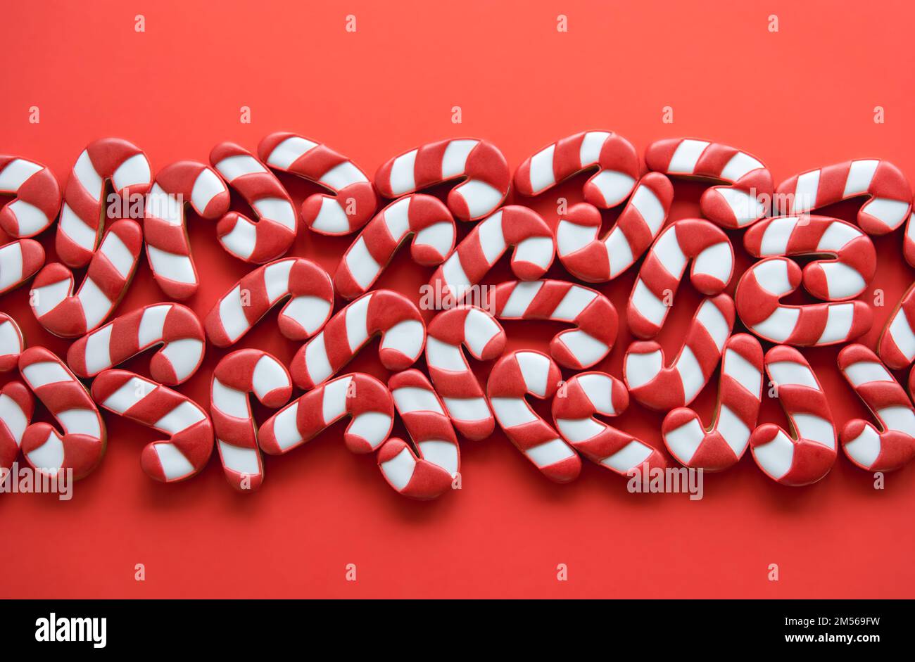 A lot of gingerbread candy cane shaped cookies, flat lay Stock Photo ...
