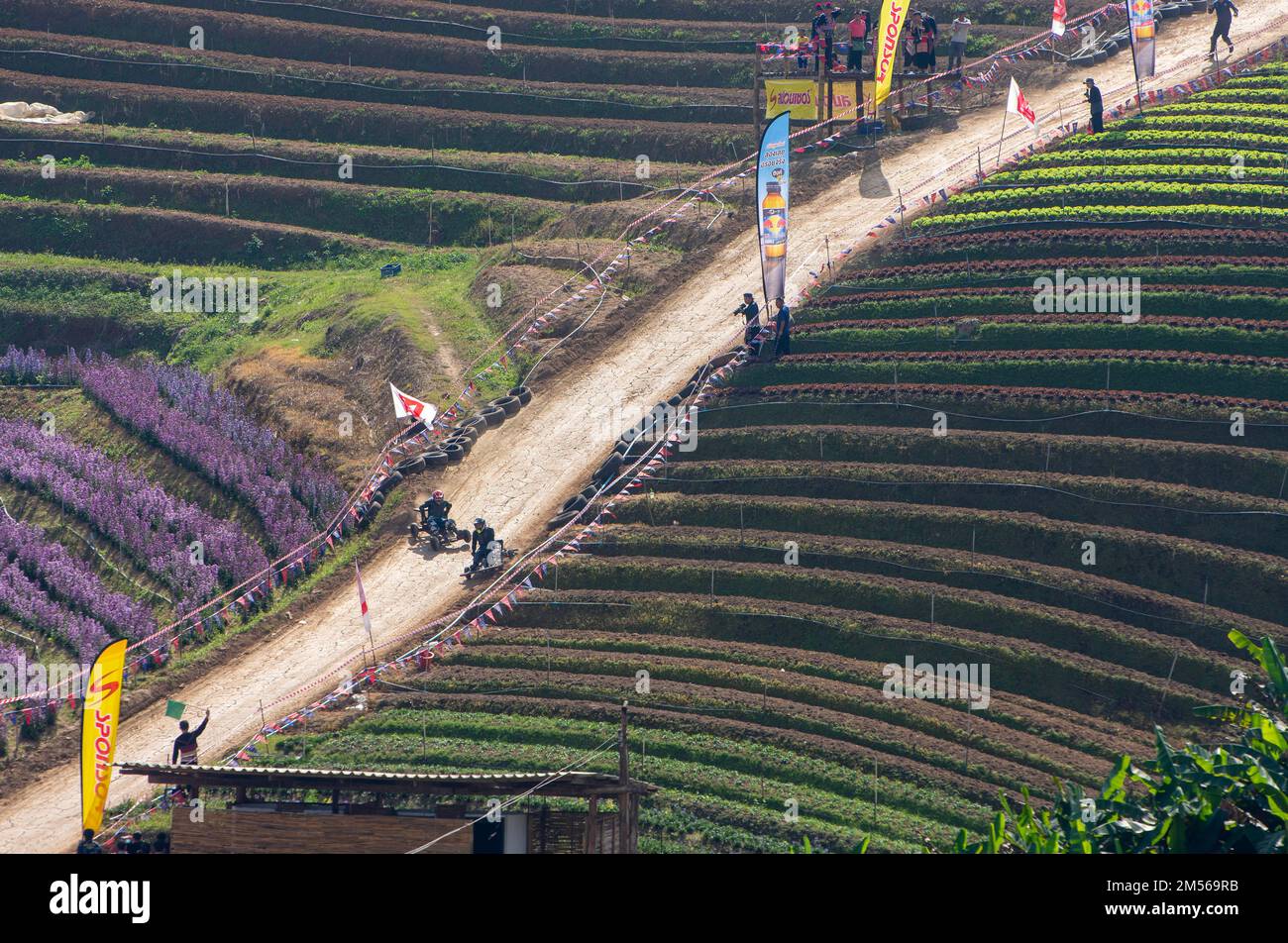 Hmong hill tribe men drive formula hmong (the wooden cart racing the ...