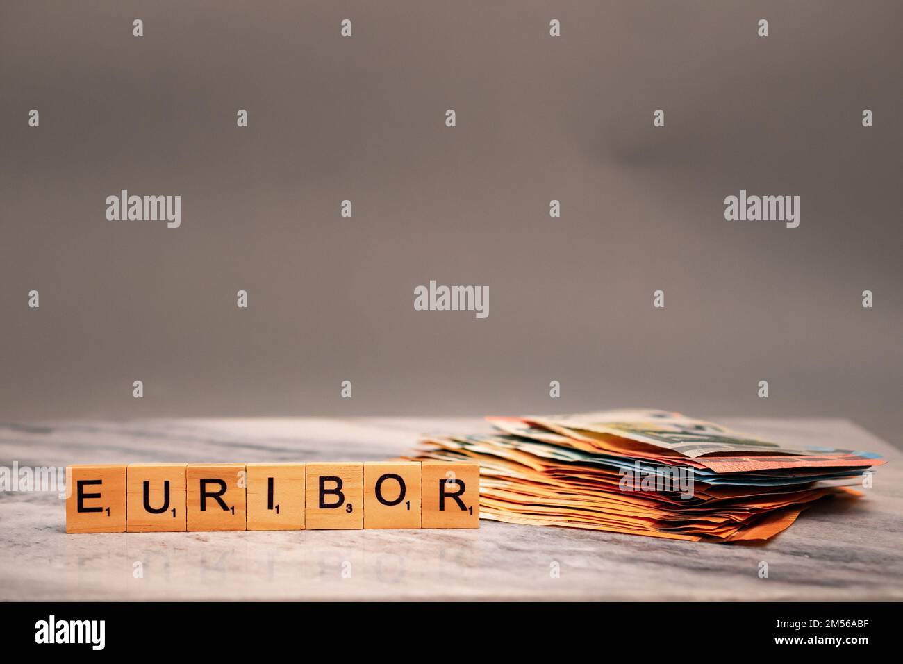 Word EURIBOR Is Written In Wooden Letters, Near Stack of Money Of 5, 10 ...