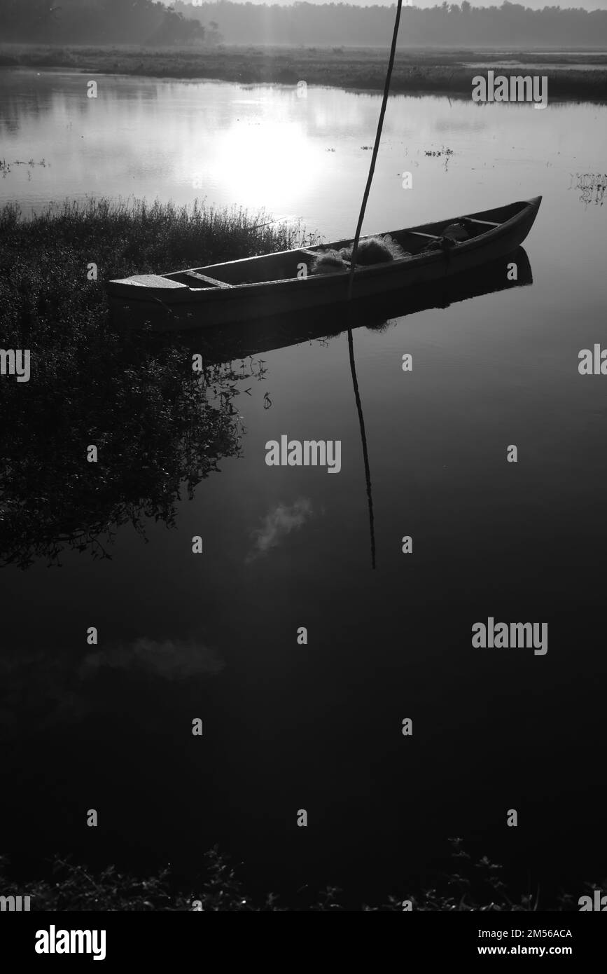 Beautiful lake with a boat Black and White Stock Photos & Images - Alamy