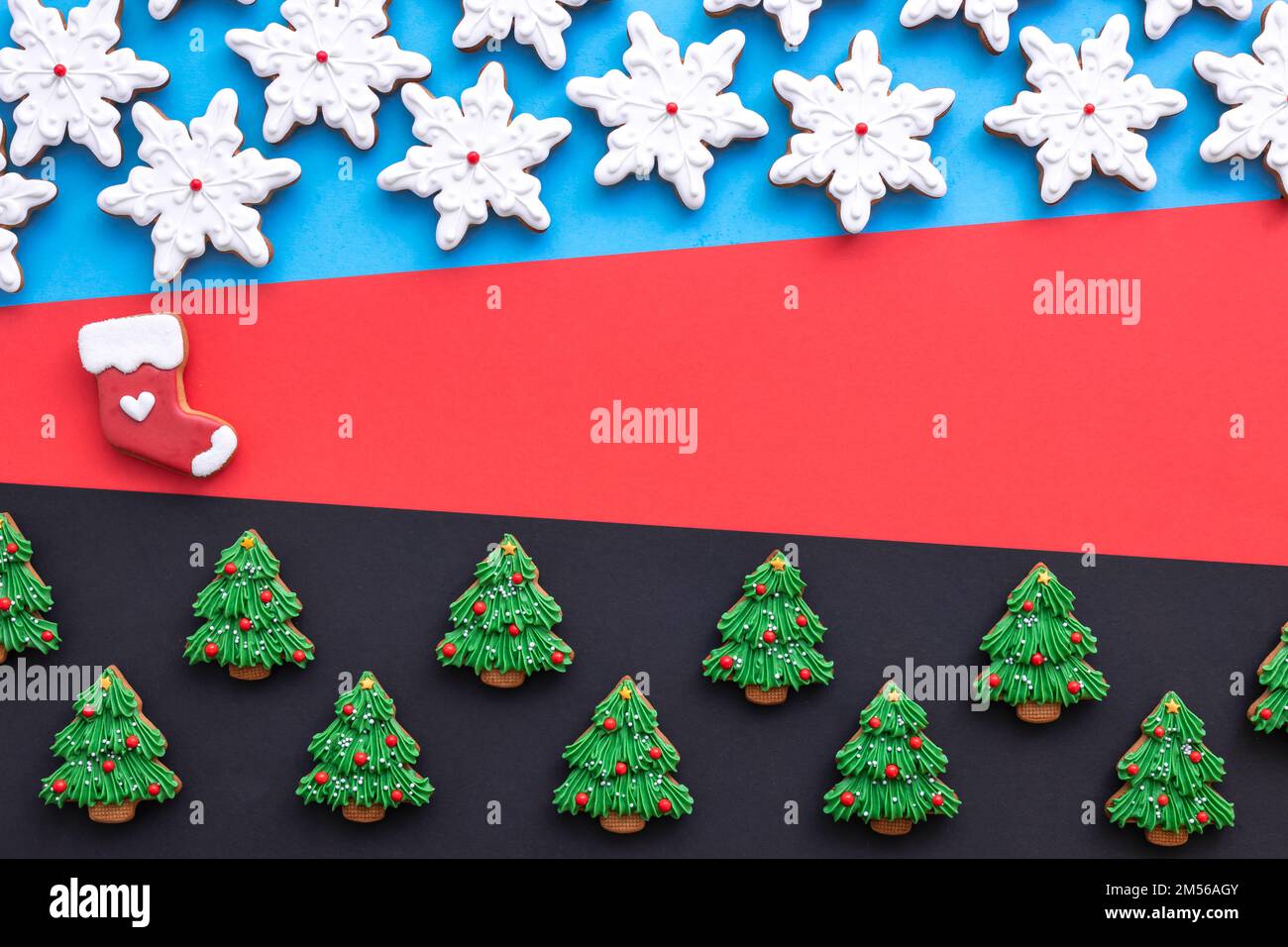 Christmas background with festive gingerbread covered with icing, flat ...
