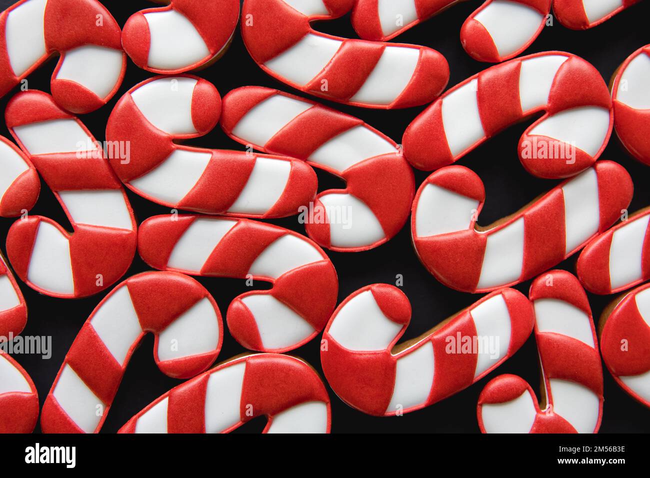 A lot of gingerbread candy cane shaped cookies, flat lay Stock Photo ...