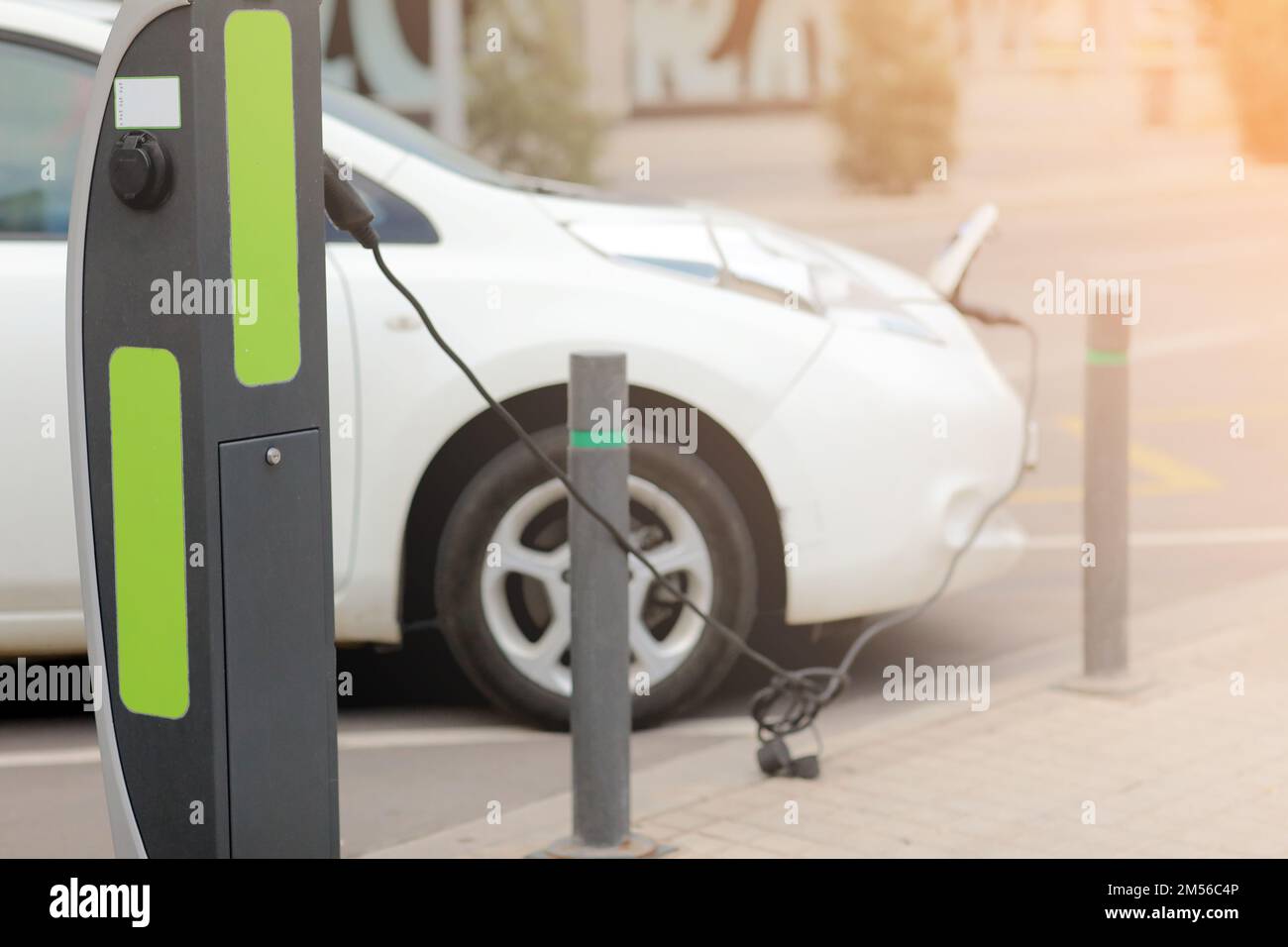 Charging modern electric cars, new energy vehicles, NEV, on the street ...