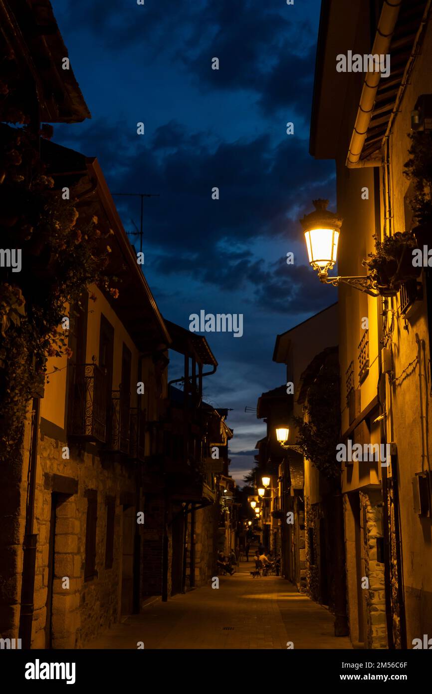 The sun sets along Calle Real in the village of Molinaseca, León, Spain ...