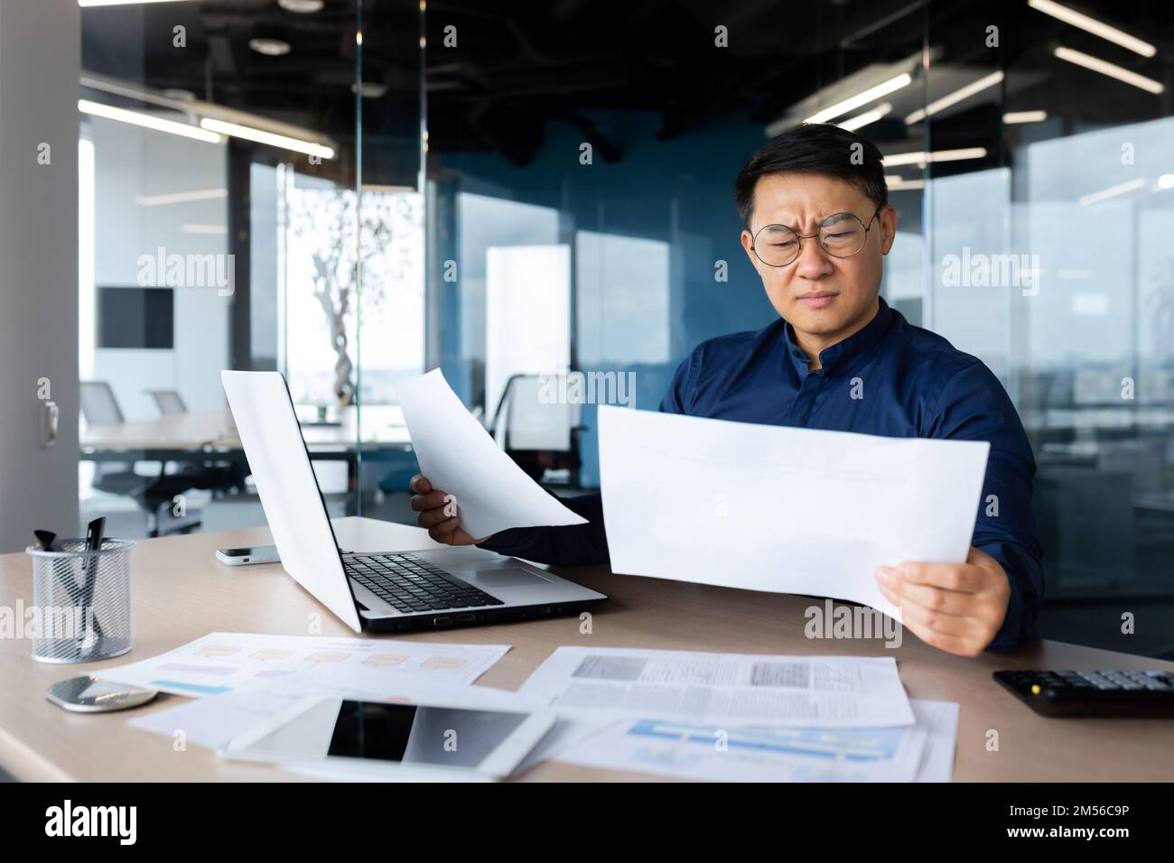 Banker works on laptop in hi-res stock photography and images - Alamy