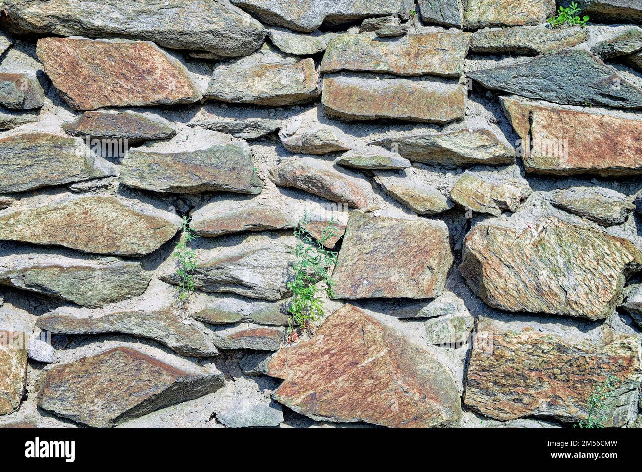 The texture of the masonry wall of natural stone. Detail of a stone ...