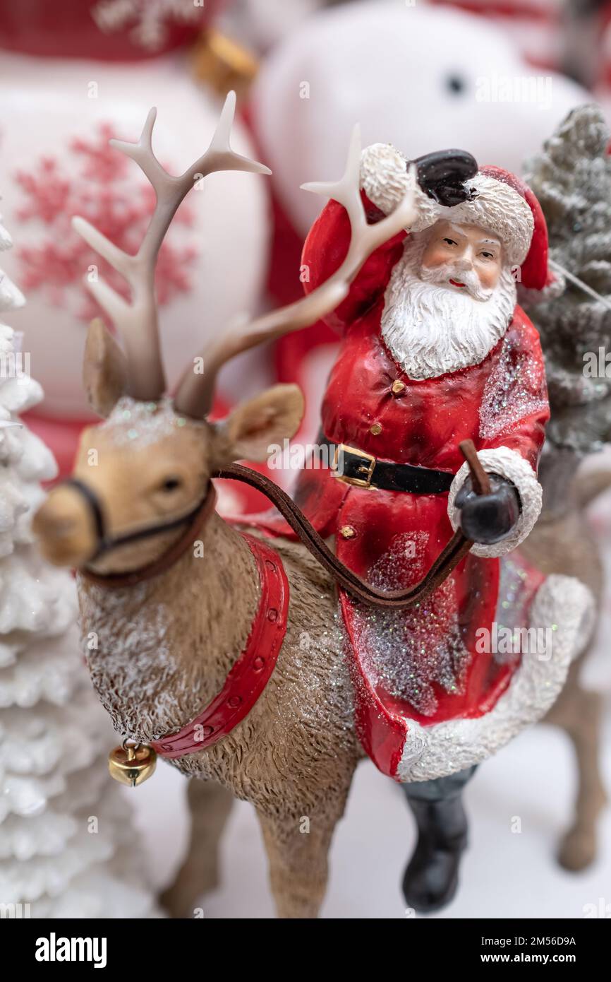 Christmas decoration, Santa Claus riding on a reindeer. Christmas eve ...