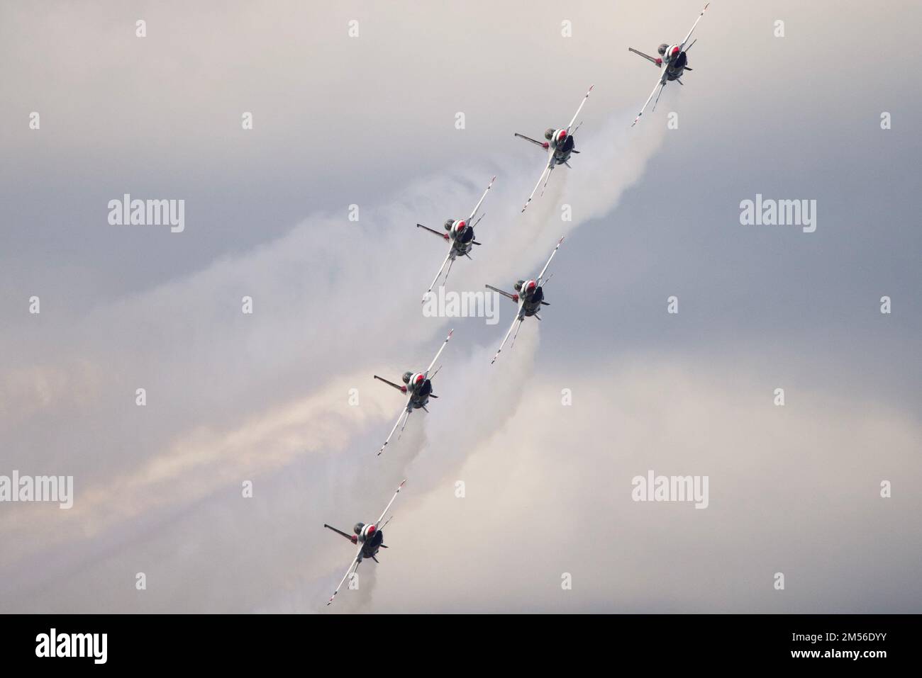 A low angle of planes flying in a row during an airshow Stock Photo - Alamy