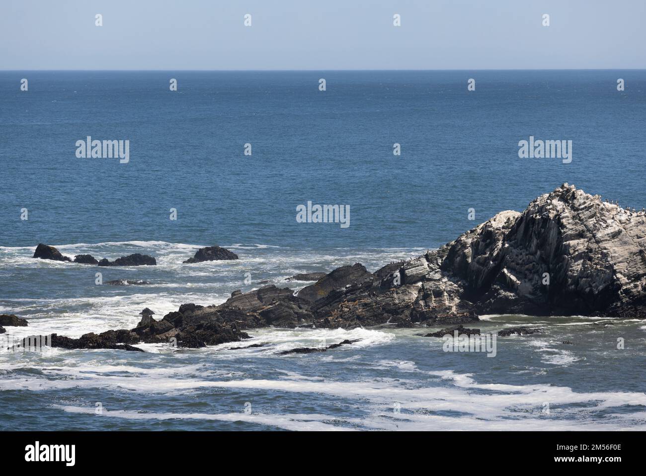 Big serrated rocks inhabited by sea lions at Isla Maiquillahue in the ...