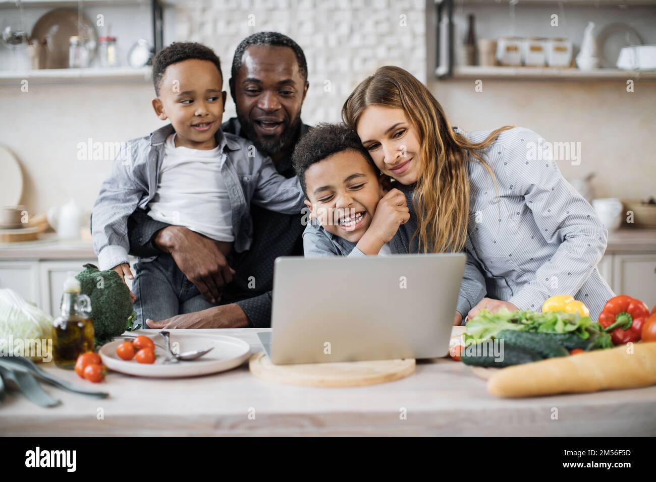 Multinational family of african cute little sons, father and caucasian ...