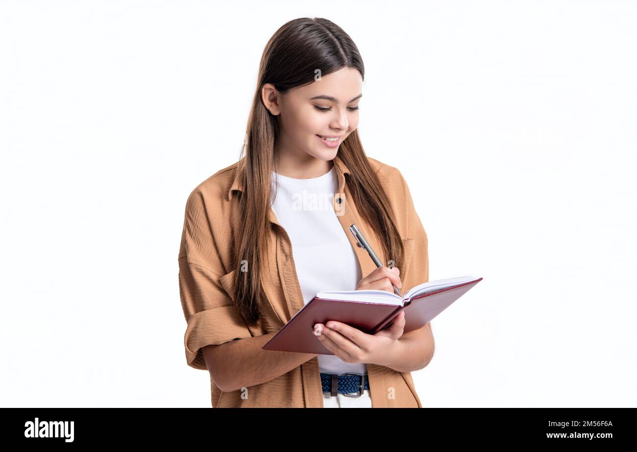 photo of cheerful teen girl noting school diary. teen girl noting ...