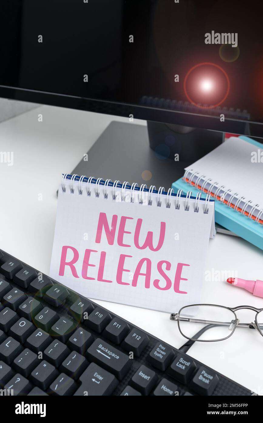 Sign displaying New Release. Business concept announcing something ...