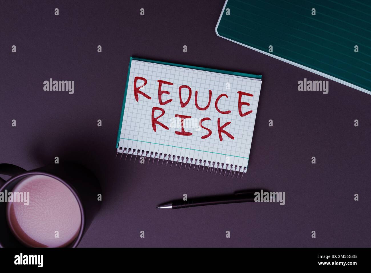 Hand writing sign Reduce Risk. Business overview lessen the potential ...