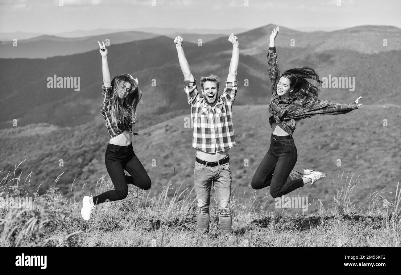 Reached top. Happy cheerful friends celebrate reaching top mountain ...