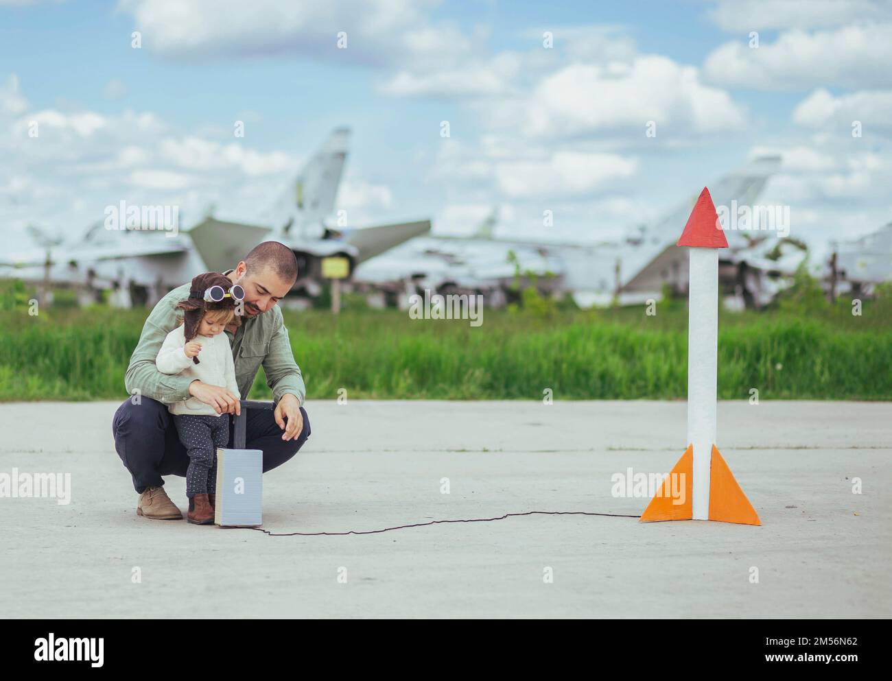 Father and daughter launch a rocket at the aerodrome Stock Photo - Alamy