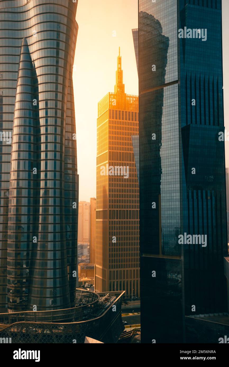 The bright sun shining over a skyscraper in Doha, Qatar Stock Photo - Alamy