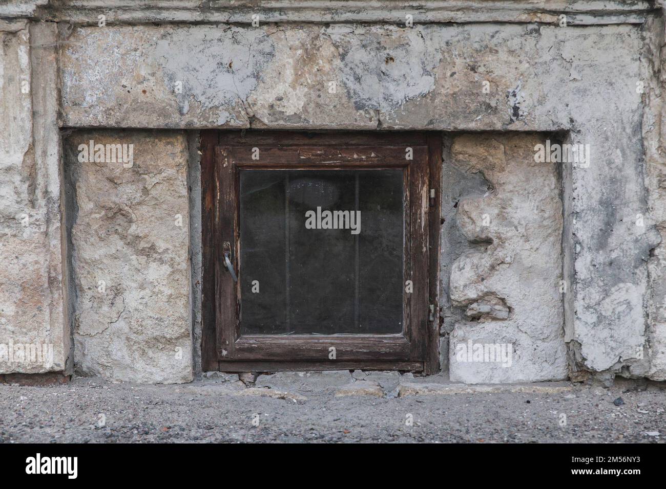 Small shabby basement window in a stone building Stock Photo - Alamy