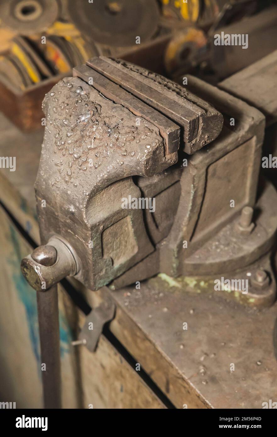 Old vise with drips of molten metal Stock Photo - Alamy