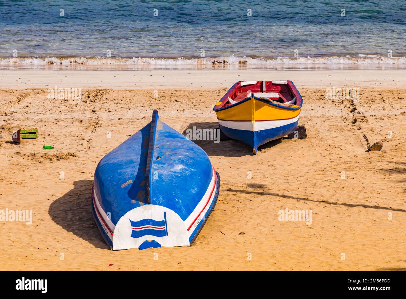 Two boats on the beach of Tarrafal in the north of Santiago Island ...