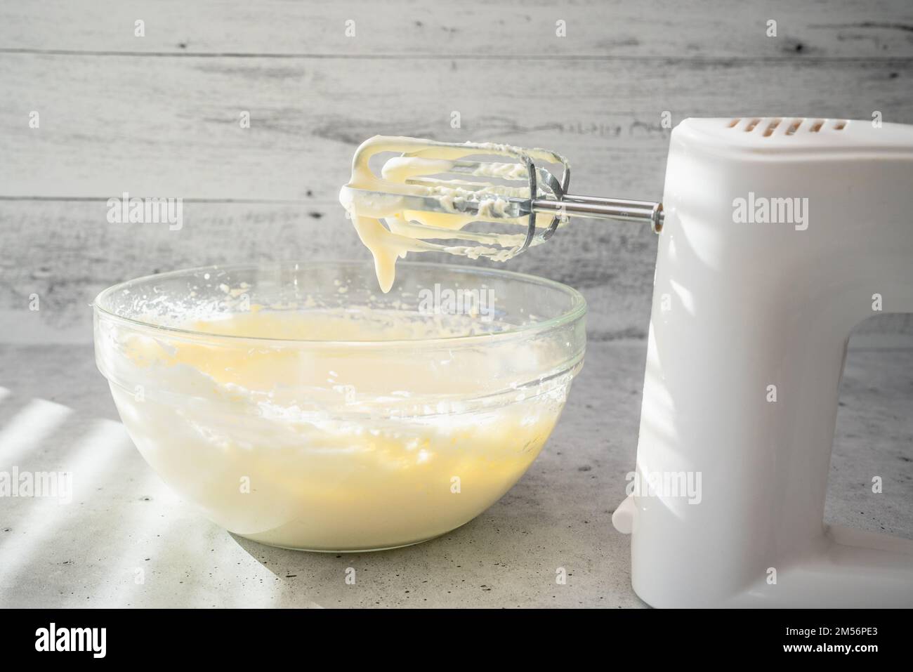 Cheesecake batter in a glass bowl. Cheesecake recipe, preparation ...