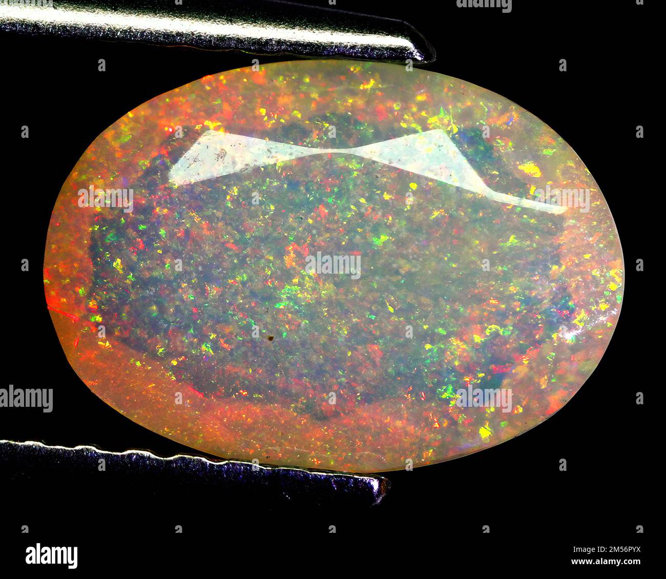 Natural beautiful stone opal on gray background Stock Photo - Alamy