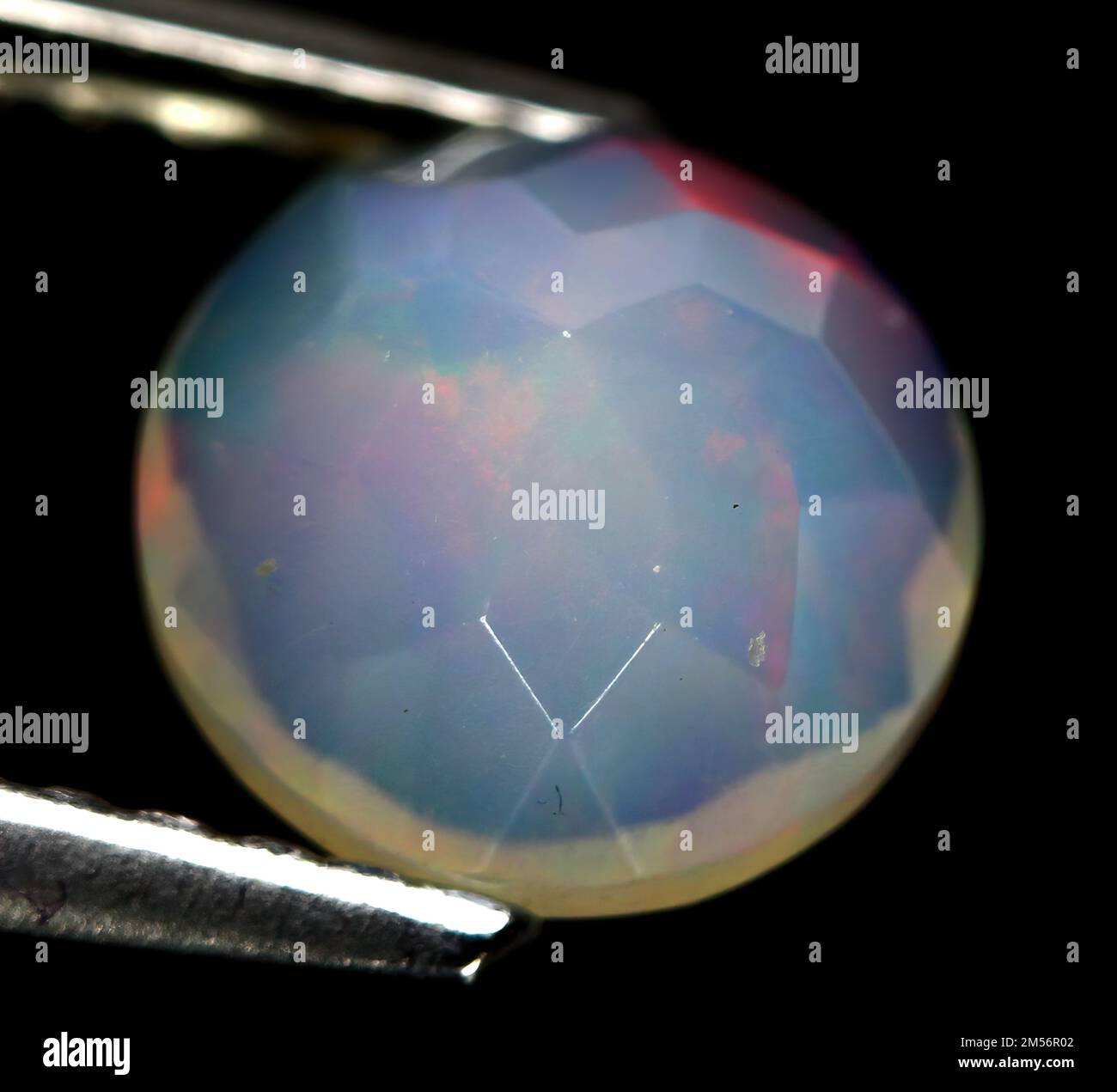 Natural beautiful stone opal on gray background Stock Photo - Alamy