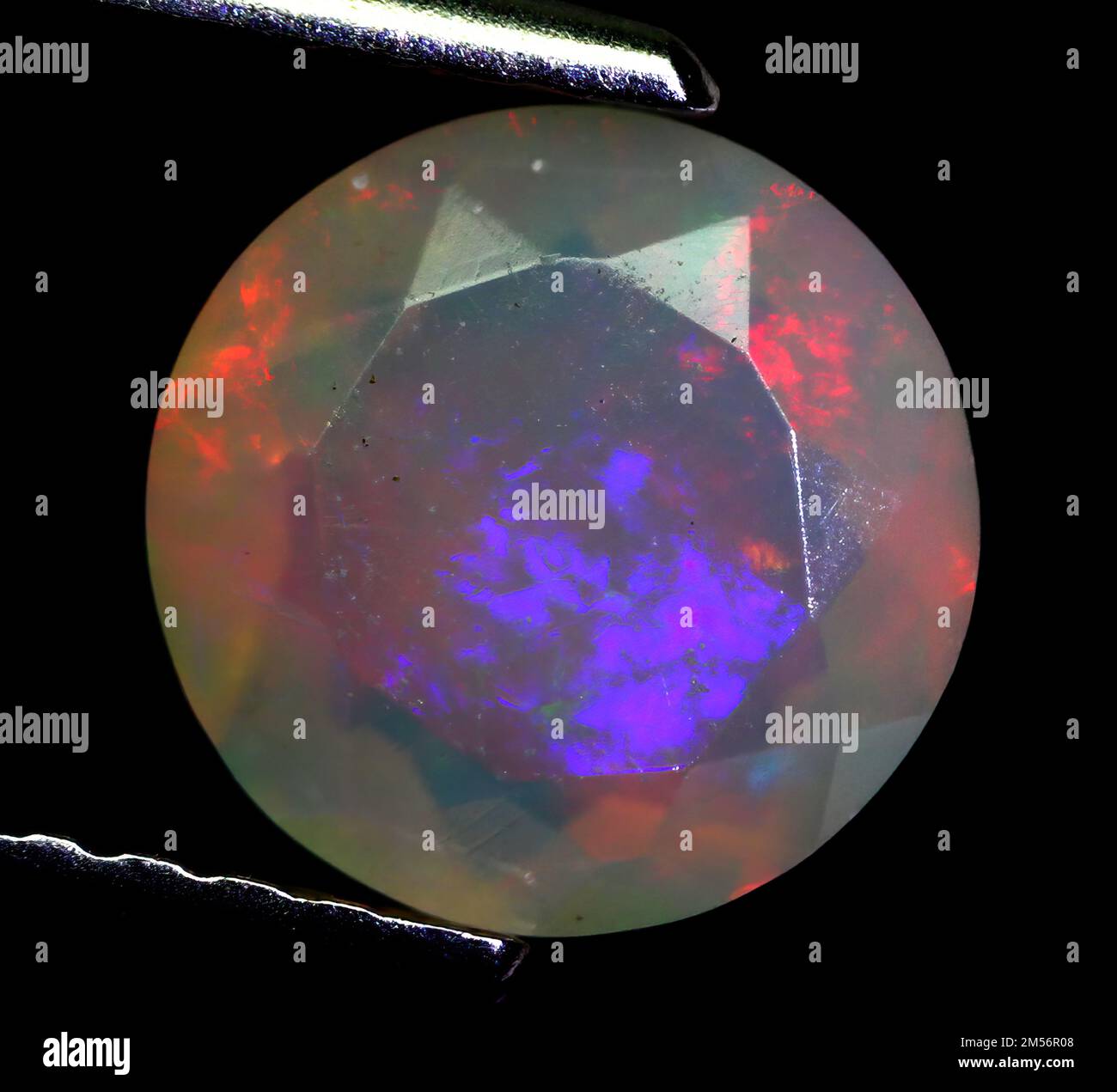 Natural beautiful stone opal on gray background Stock Photo - Alamy