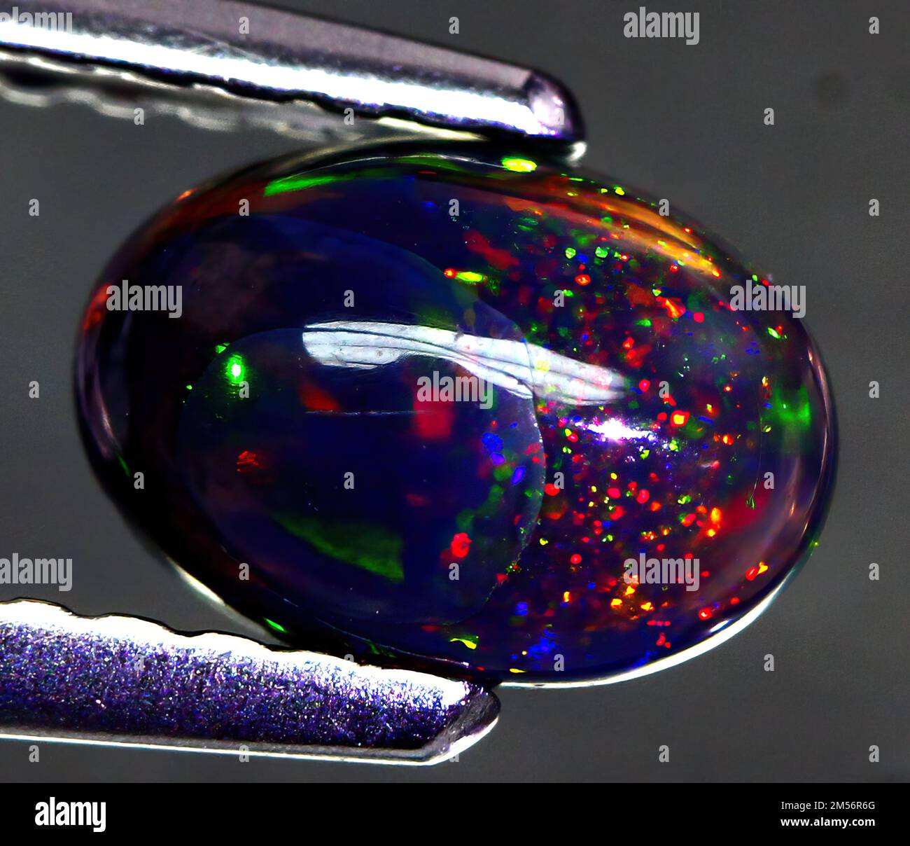 Natural beautiful stone opal on gray background Stock Photo - Alamy