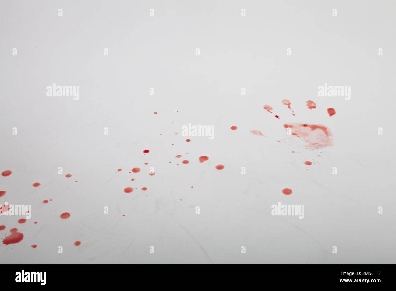 The bloody trails of hands and dripped blood on the white ground Stock ...