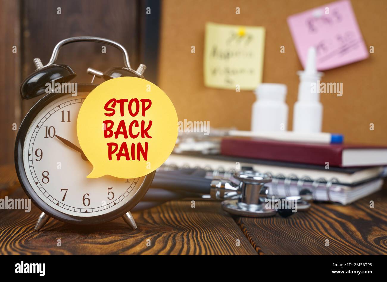 Medical concept. On the alarm clock a sticker with the inscription ...