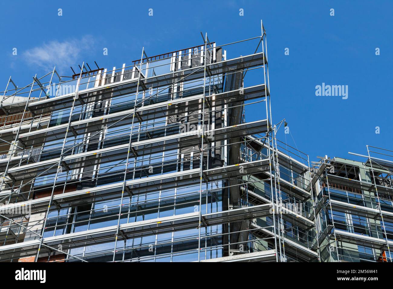 Modern house is under construction, glass facade and scaffolding structure Stock Photo - Alamy