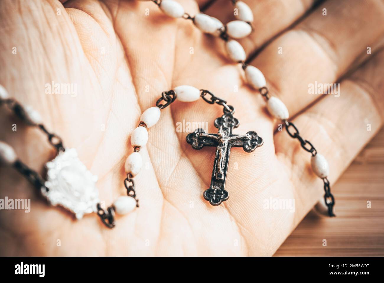Hand with rosary, Catholic faith and prayer concept Stock Photo - Alamy