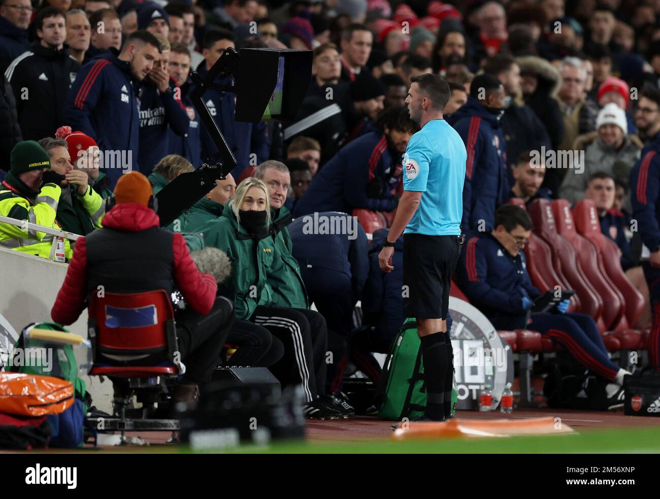 Match referee Michael Oliver view the monitor before overturning his ...