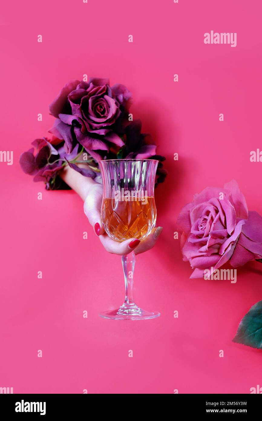 Trend paper whole woman hand with a glass of liquor . Holiday ...