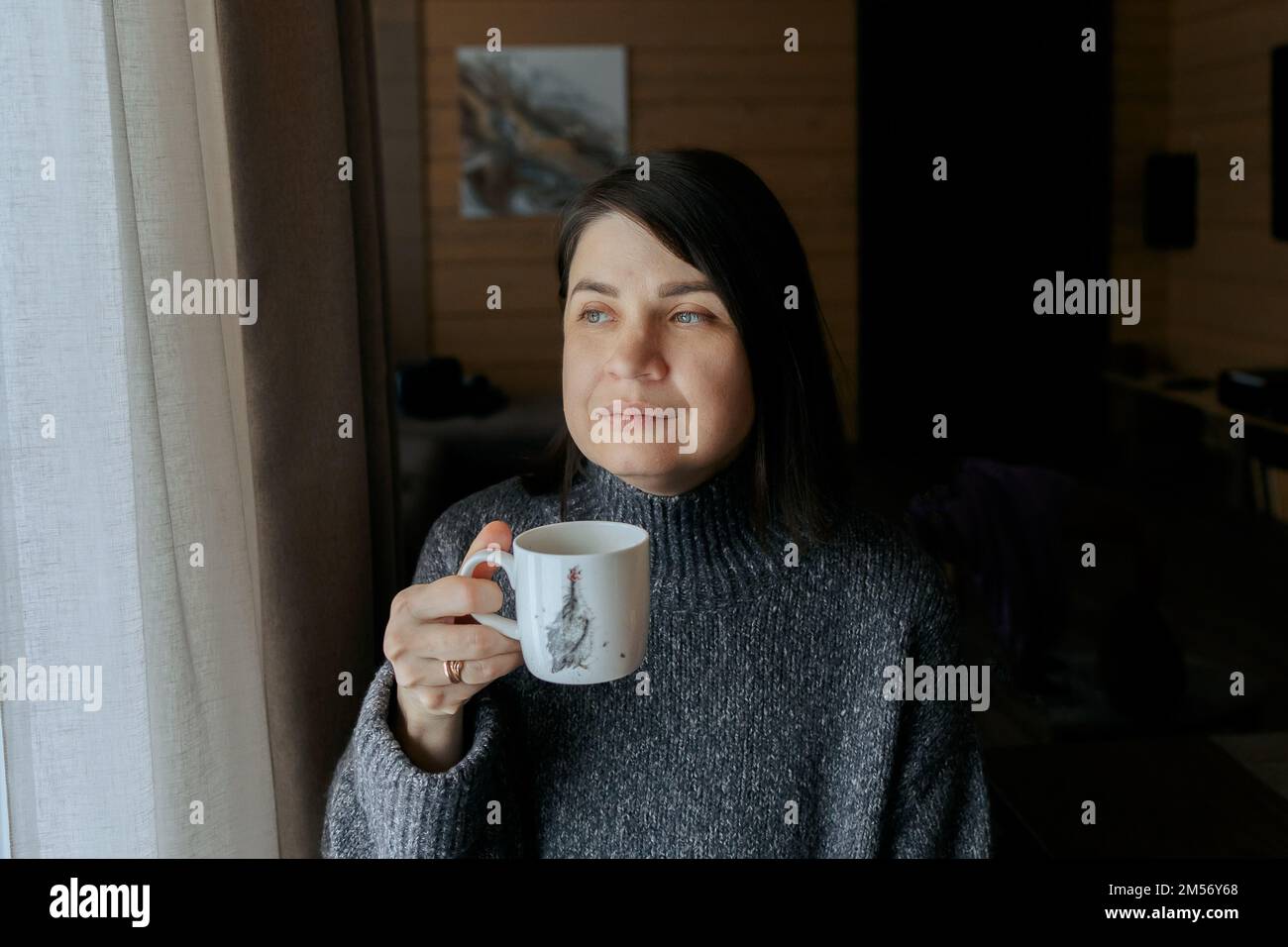 Portrait of pensive woman. Girl with cup of coffee. Female drinking tea ...