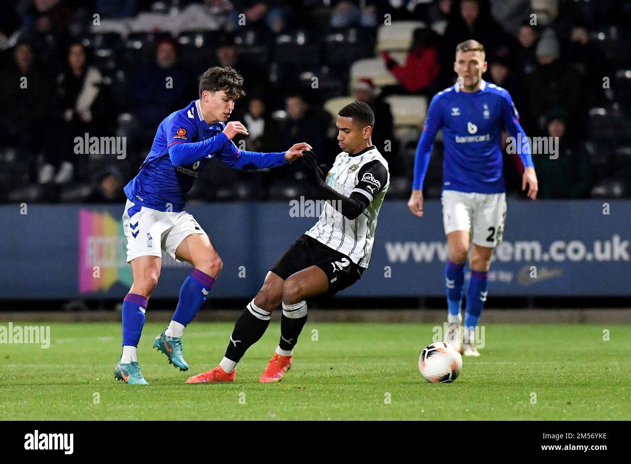 Nottingham, UK. 26th Dec, 2022. Benny Couto of Oldham Athletic tussles ...