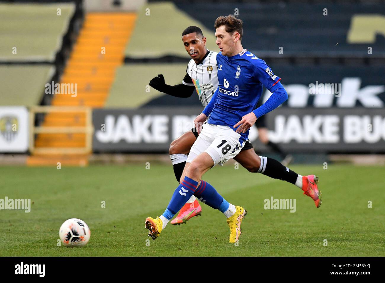 Nottingham, UK. 26th Dec, 2022. Ben Tollitt of Oldham Athletic tussles ...