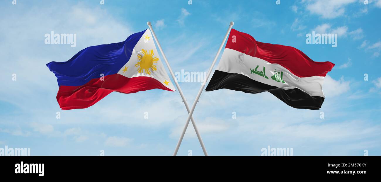 two crossed flags Iraq and Philippines waving in wind at cloudy sky ...