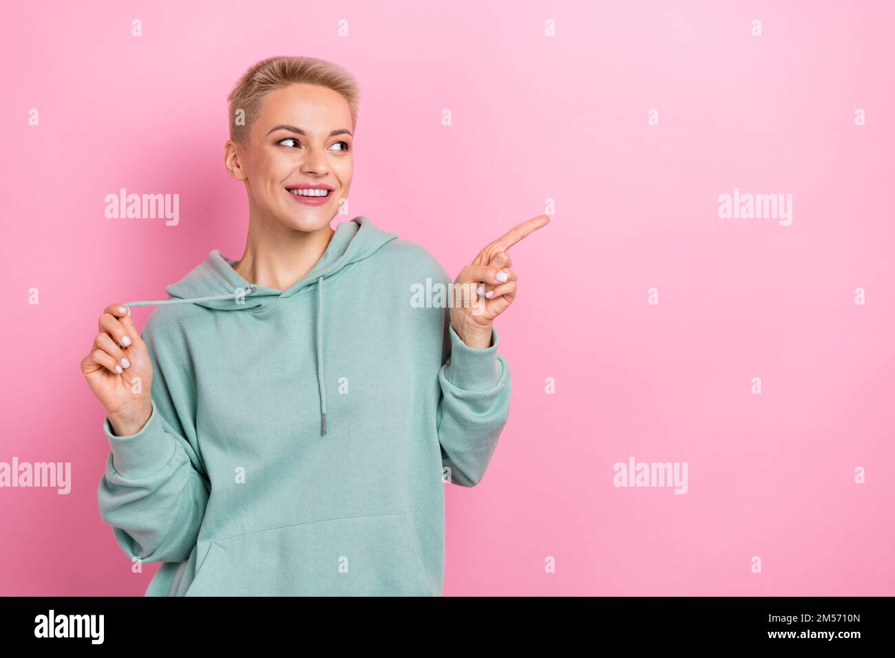 Photo portrait of attractive young woman toothy smile point empty space ...