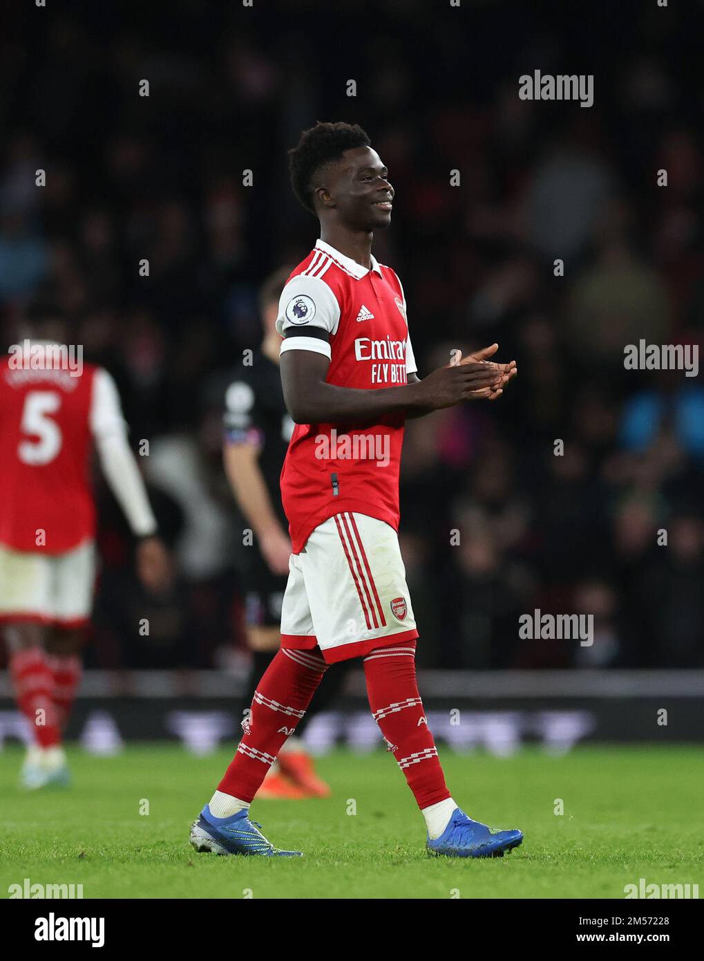 Arsenal's Bukayo Saka celebrates after the Premier League match at the ...