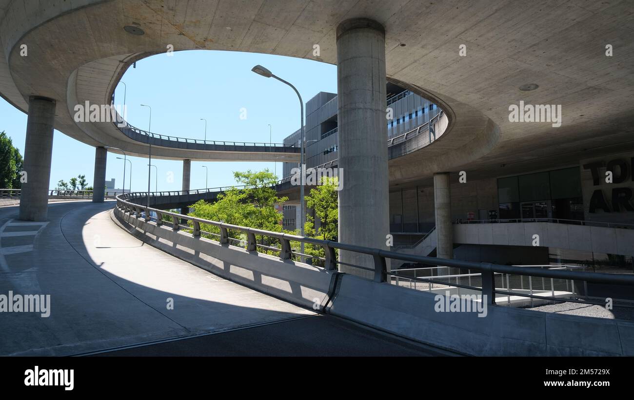 The curved ramp, road leading down to the car parking space Stock Photo ...
