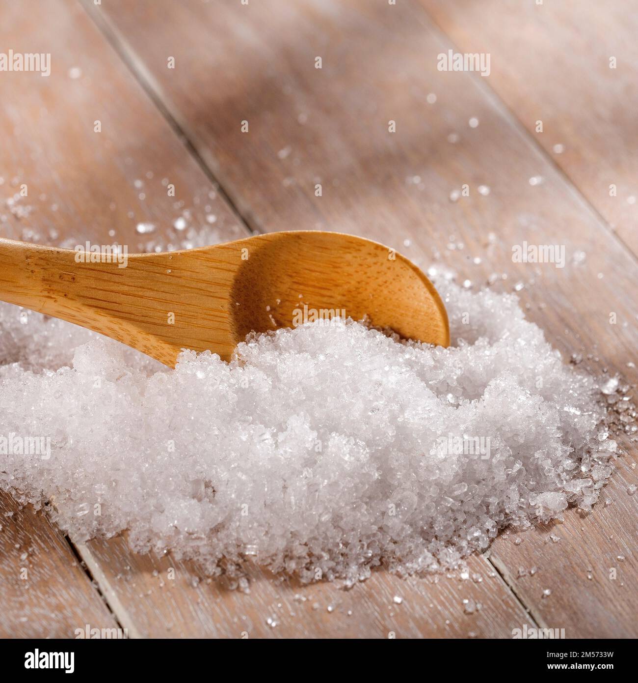 Magnesium chloride in wooden spoon - healthy fine crystals Stock Photo ...