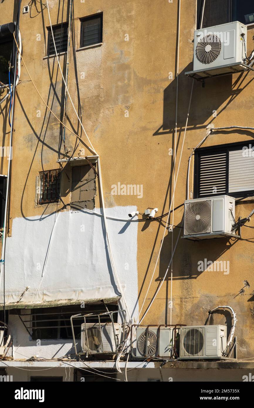 Weathered building with air conditioners Stock Photo - Alamy