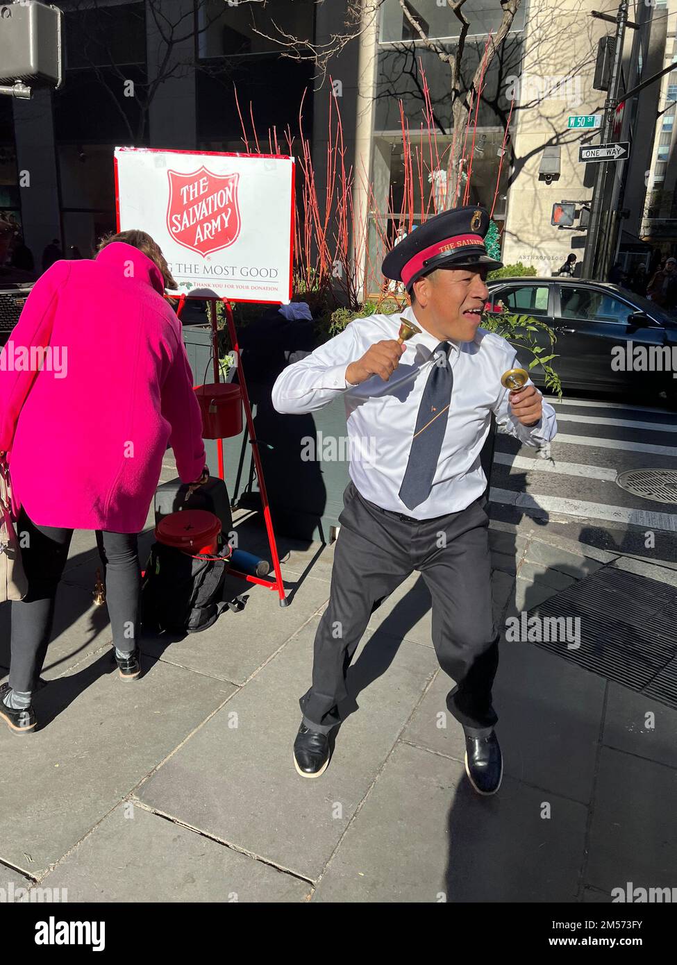 Salvation Army bell ringer singing for donations along 5th Avenue on ...