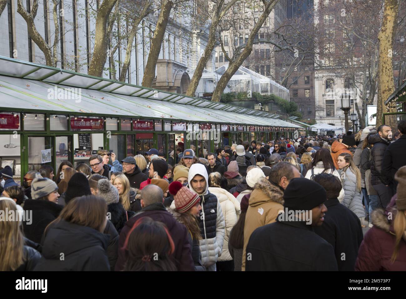 Crowds of people at the holiday shopping village at Bryant Park a week ...