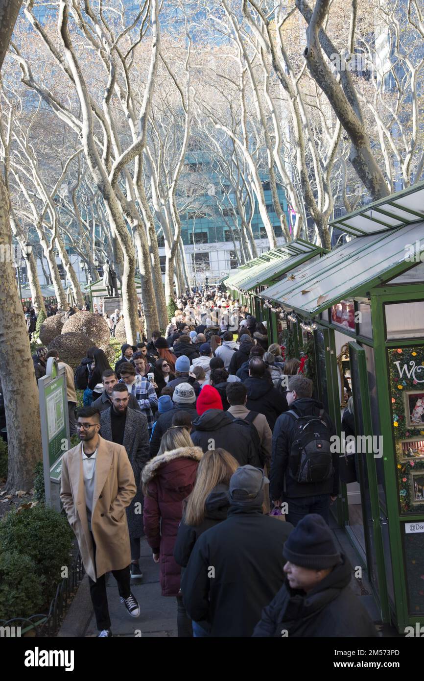Crowds of people at the holiday shopping village at Bryant Park a week ...
